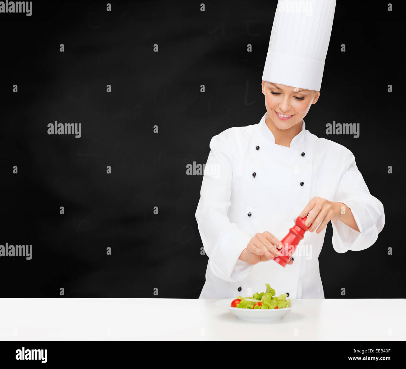 smiling female chef with preparing salad Stock Photo - Alamy