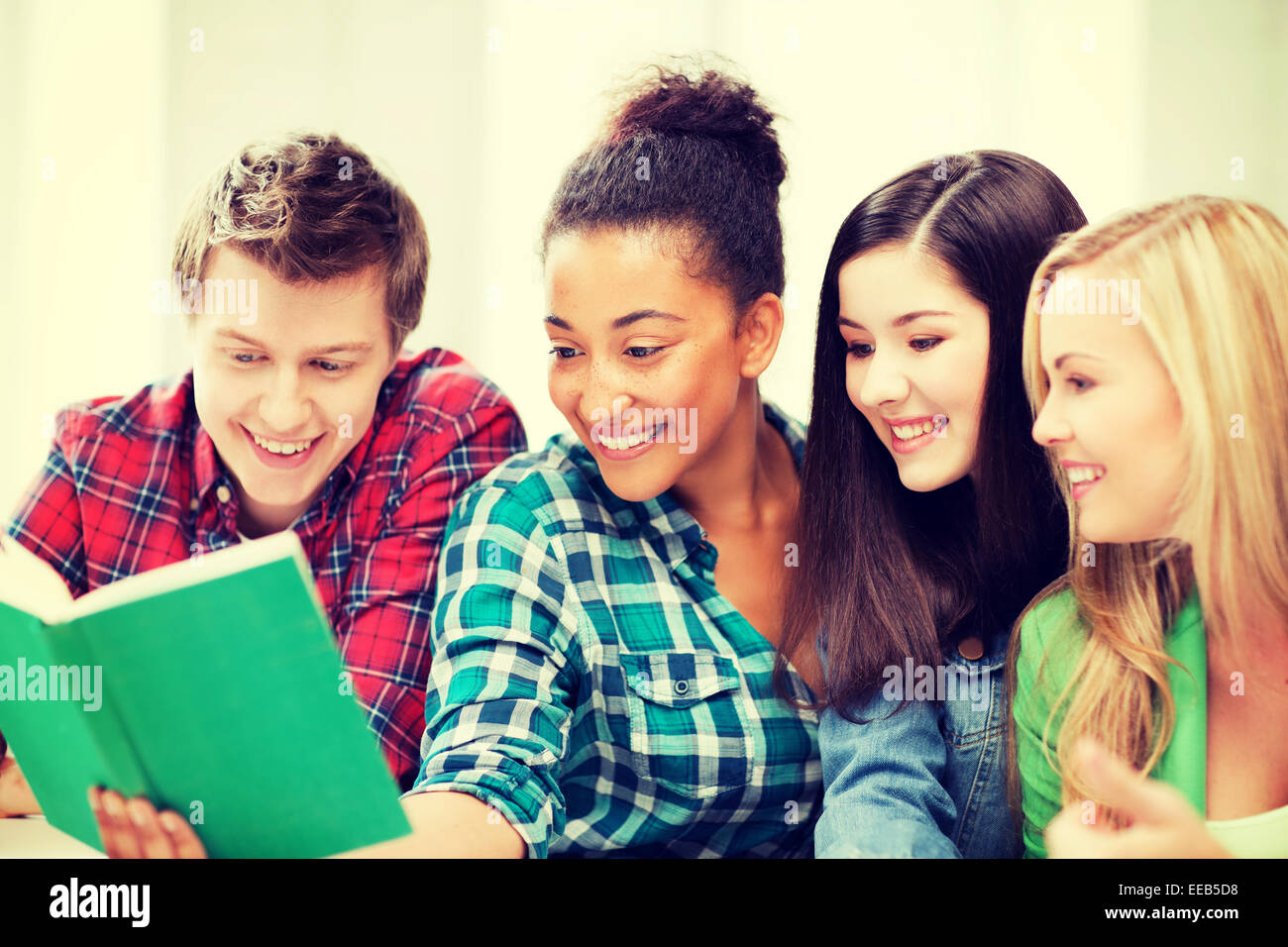students reading book at school Stock Photo - Alamy