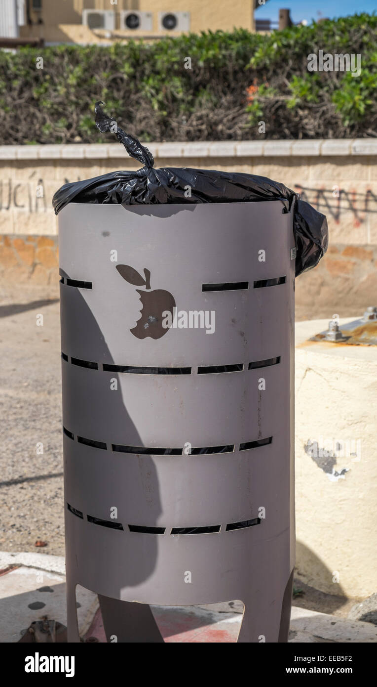 Waste bin with Apple motif on the side Stock Photo - Alamy