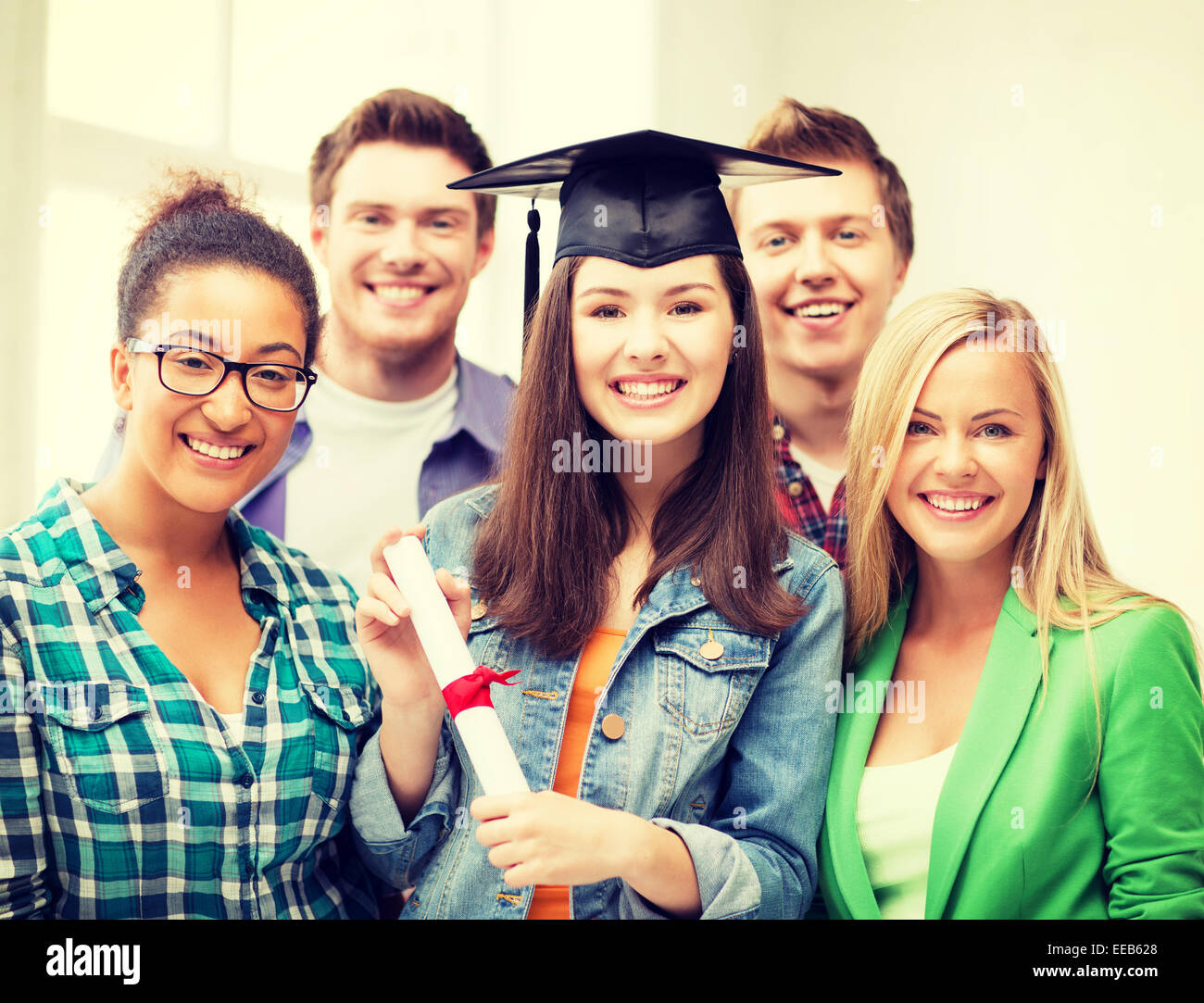 girl in graduation cap with certificate Stock Photo - Alamy