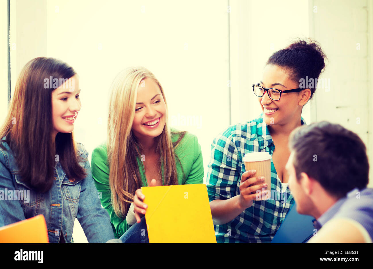 students communicating and laughing at school Stock Photo - Alamy