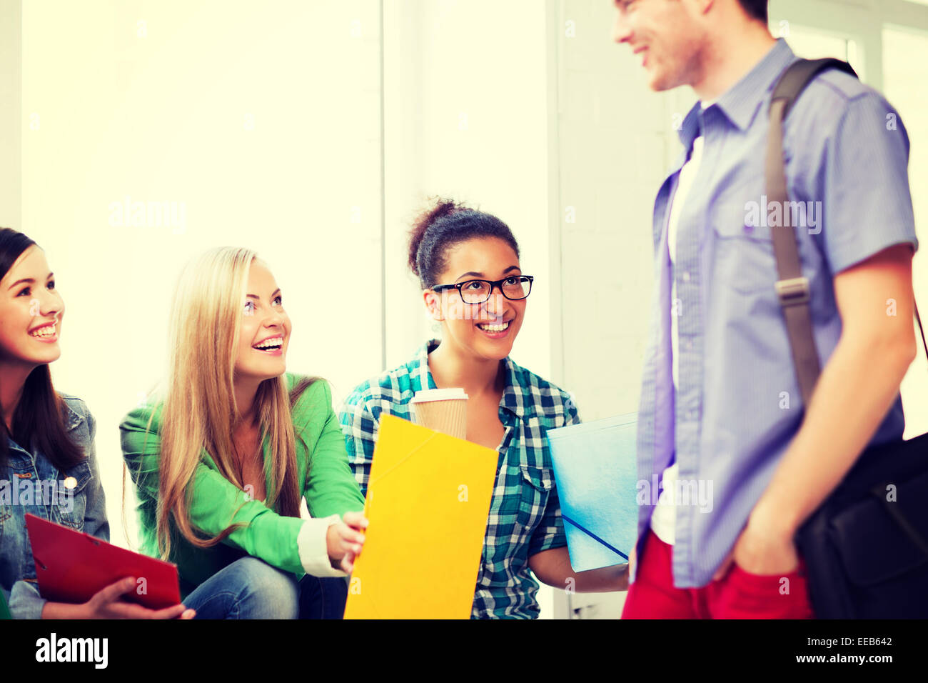 students communicating and laughing at school Stock Photo - Alamy