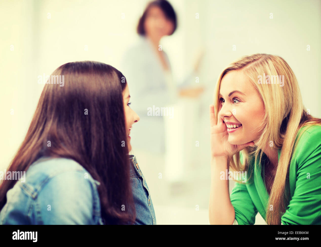 student girls gossiping at school Stock Photo - Alamy