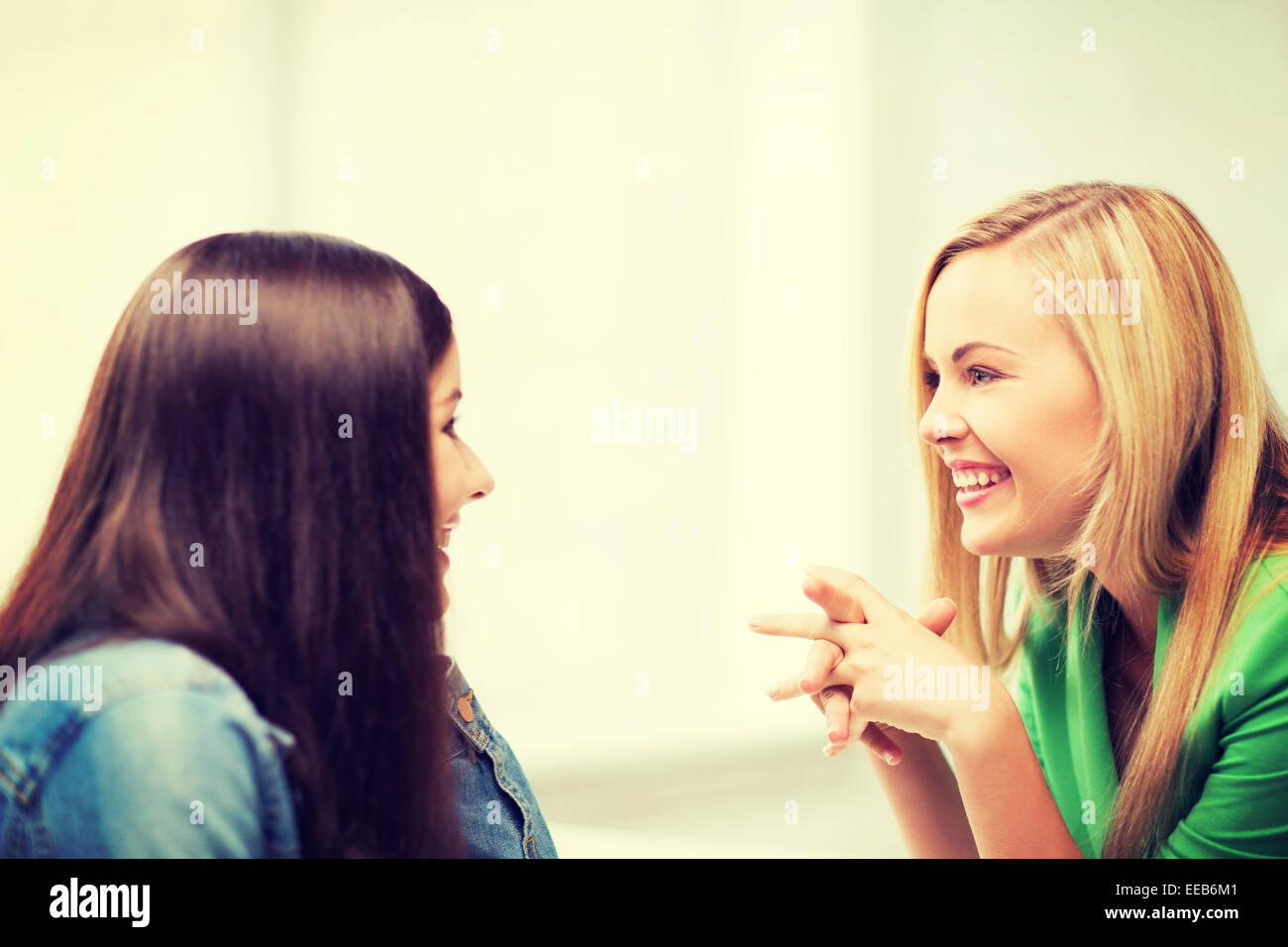 student girls gossiping at school Stock Photo - Alamy