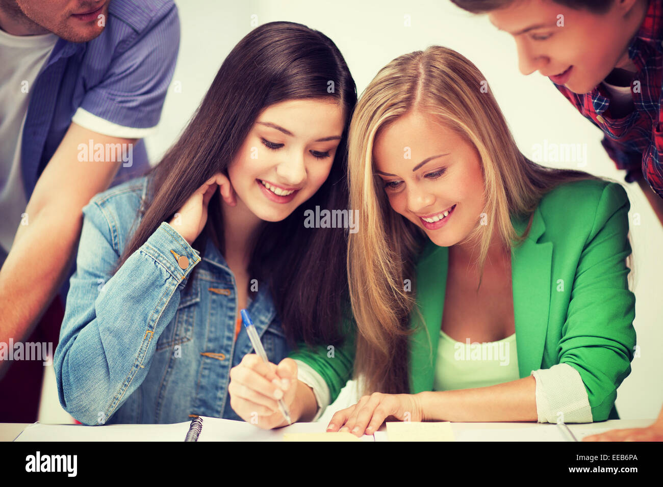 students pointing at notebook at school Stock Photo - Alamy