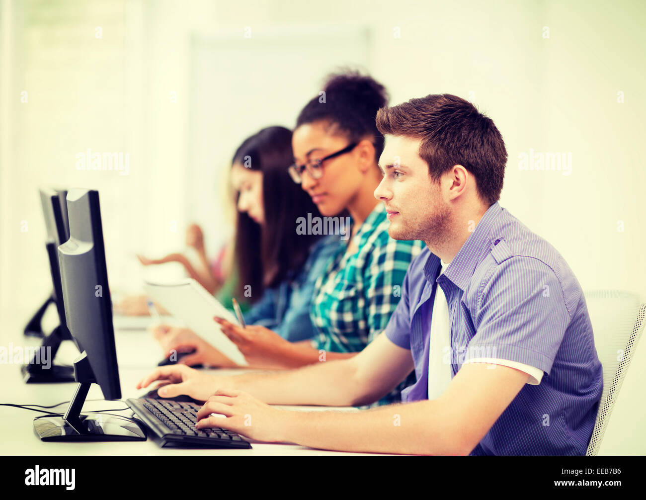 students with computers studying at school Stock Photo - Alamy