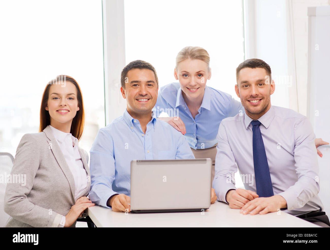 business team working with laptop in office Stock Photo - Alamy