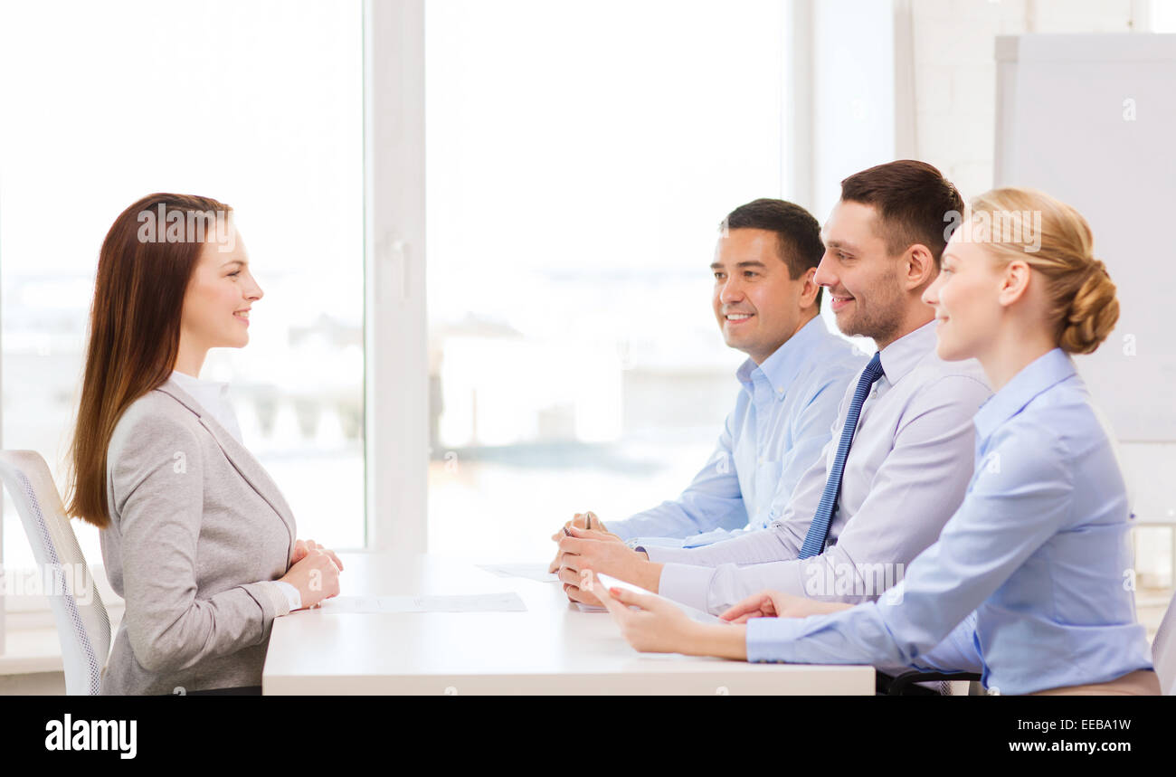 smiling businesswoman at interview in office Stock Photo - Alamy