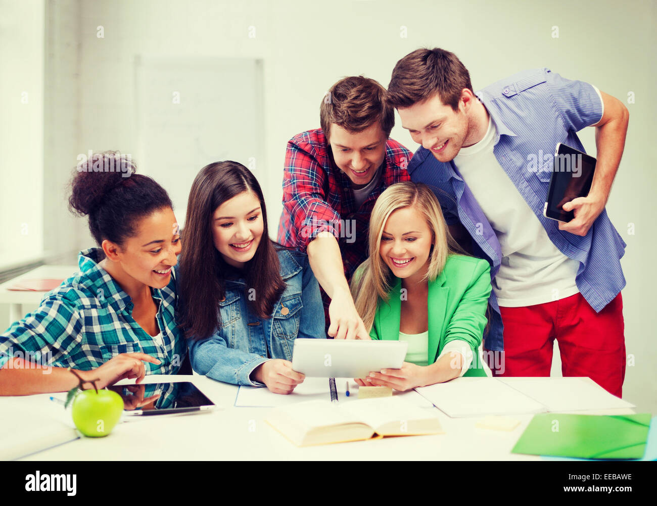 students looking at tablet pc at school Stock Photo - Alamy