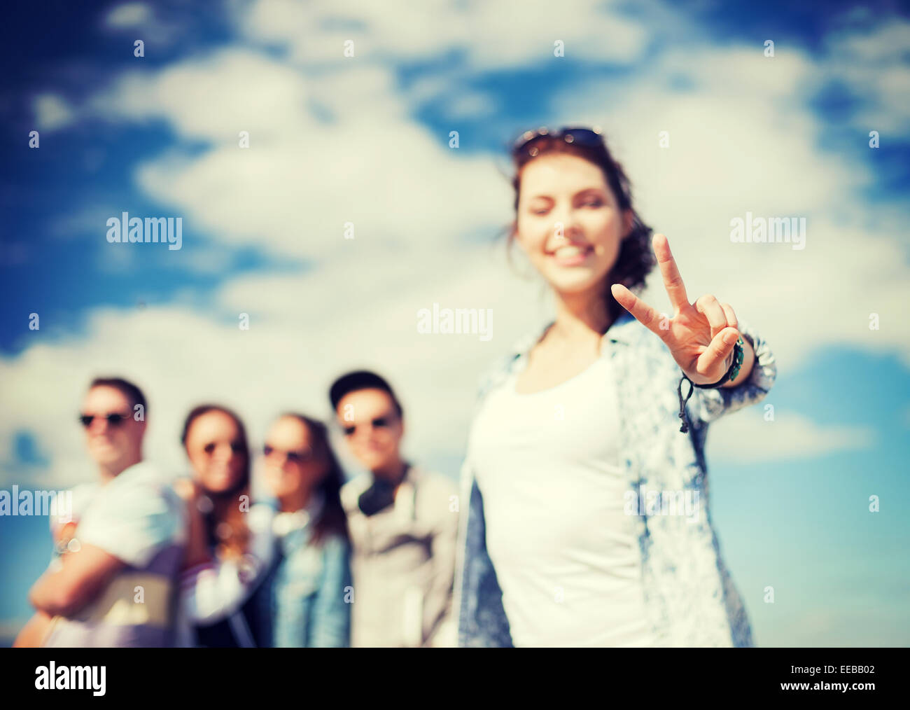 closeup of female hand showing v-sign with fingers Stock Photo - Alamy