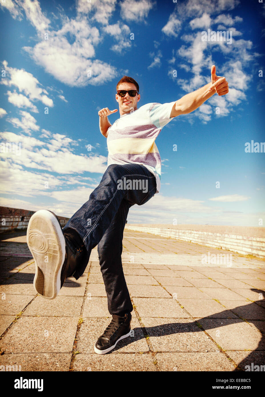 handsome boy making dance move Stock Photo - Alamy