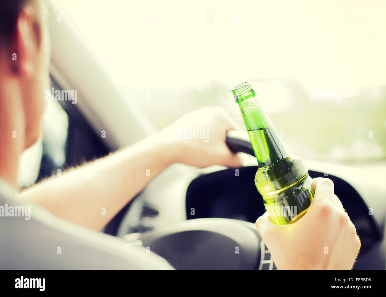 man drinking alcohol while driving the car Stock Photo - Alamy