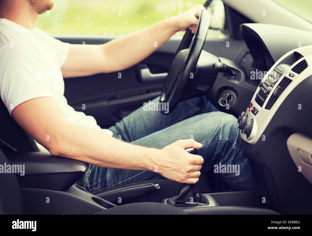 man shifting the gear on car manual gearbox Stock Photo - Alamy
