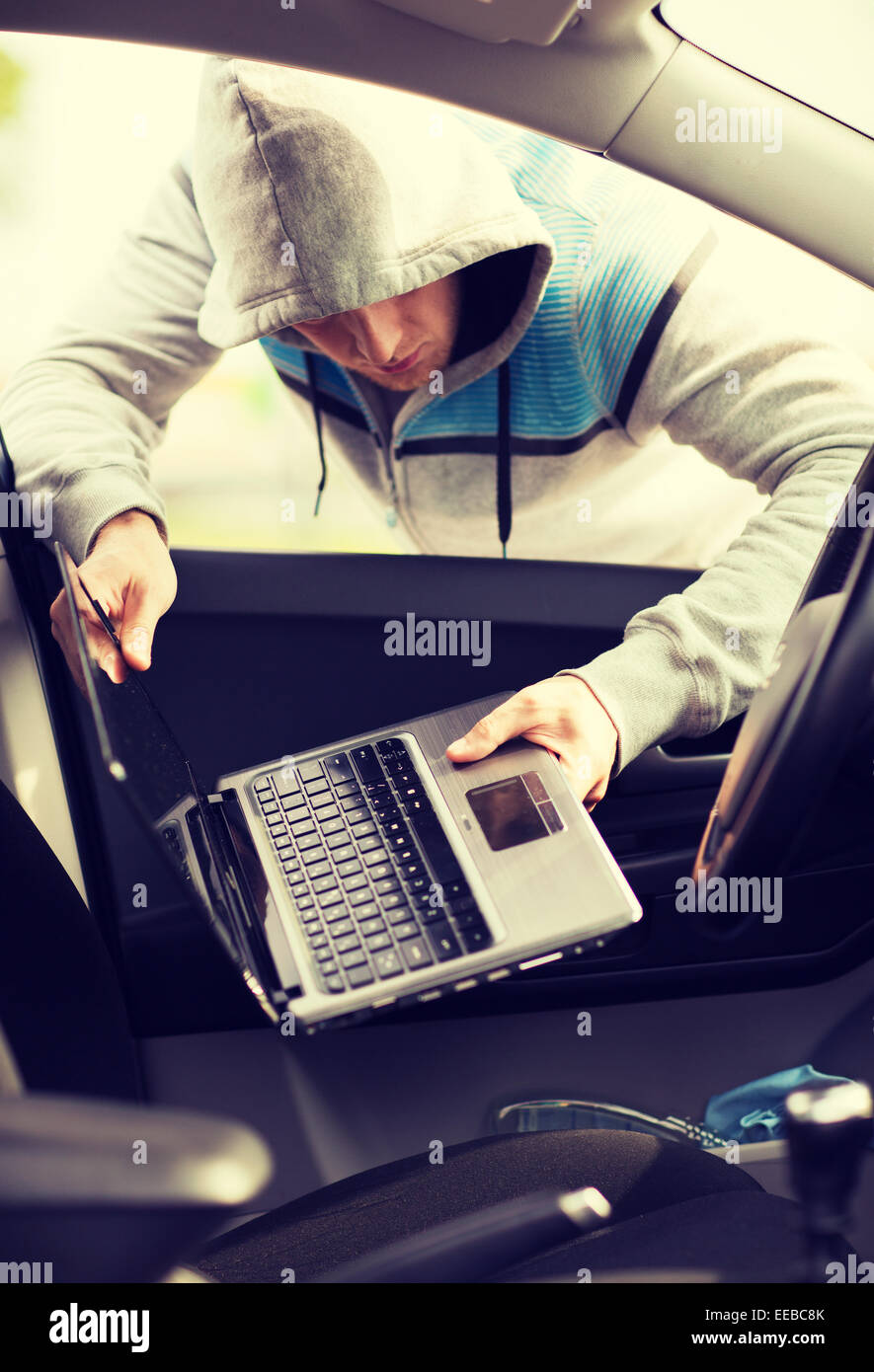 thief stealing laptop from the car Stock Photo - Alamy