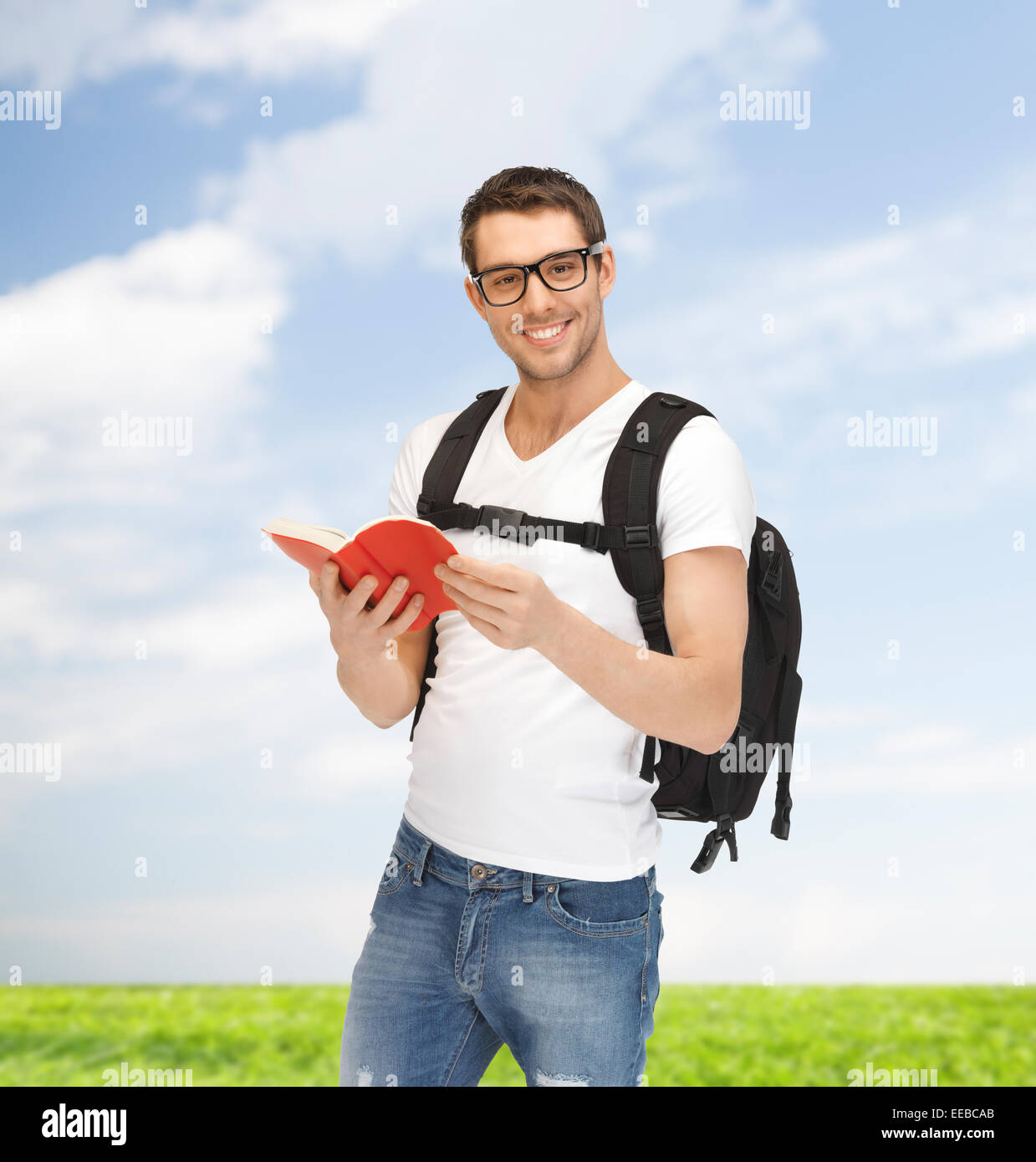 travelling student with backpack and book Stock Photo - Alamy