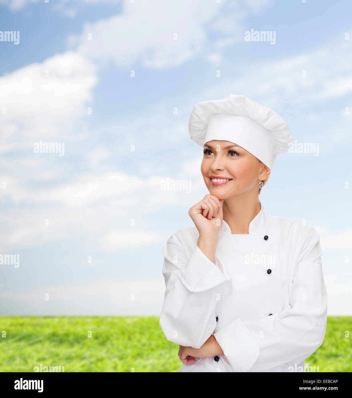 smiling female chef dreaming Stock Photo - Alamy