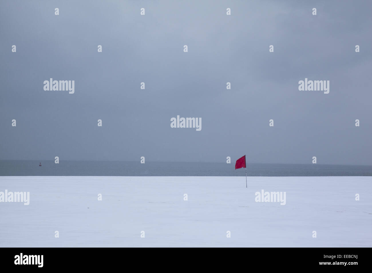 Red warning flags posted on the beach at Coney Island during the winter ...
