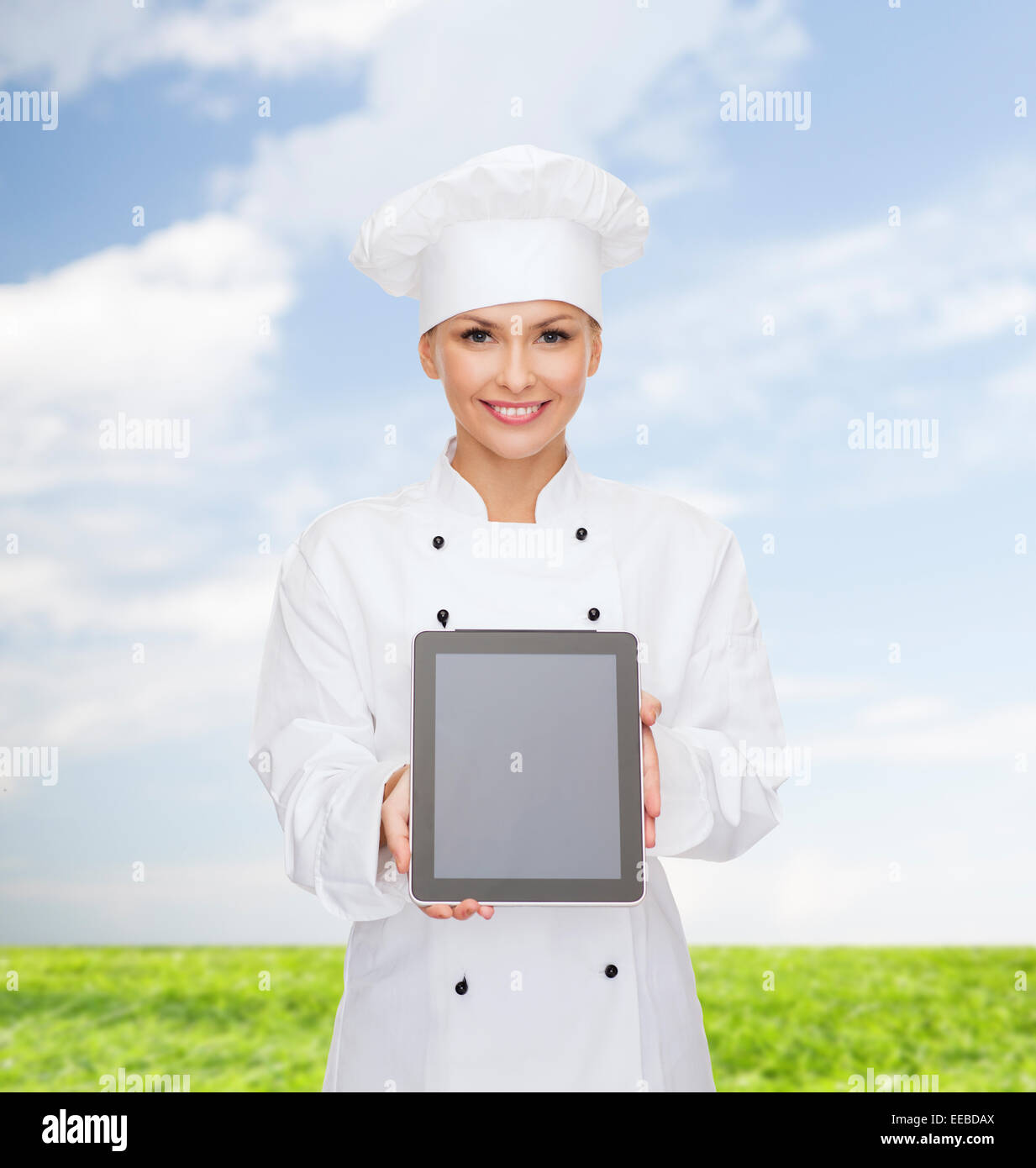 smiling female chef with tablet pc blank screen Stock Photo - Alamy