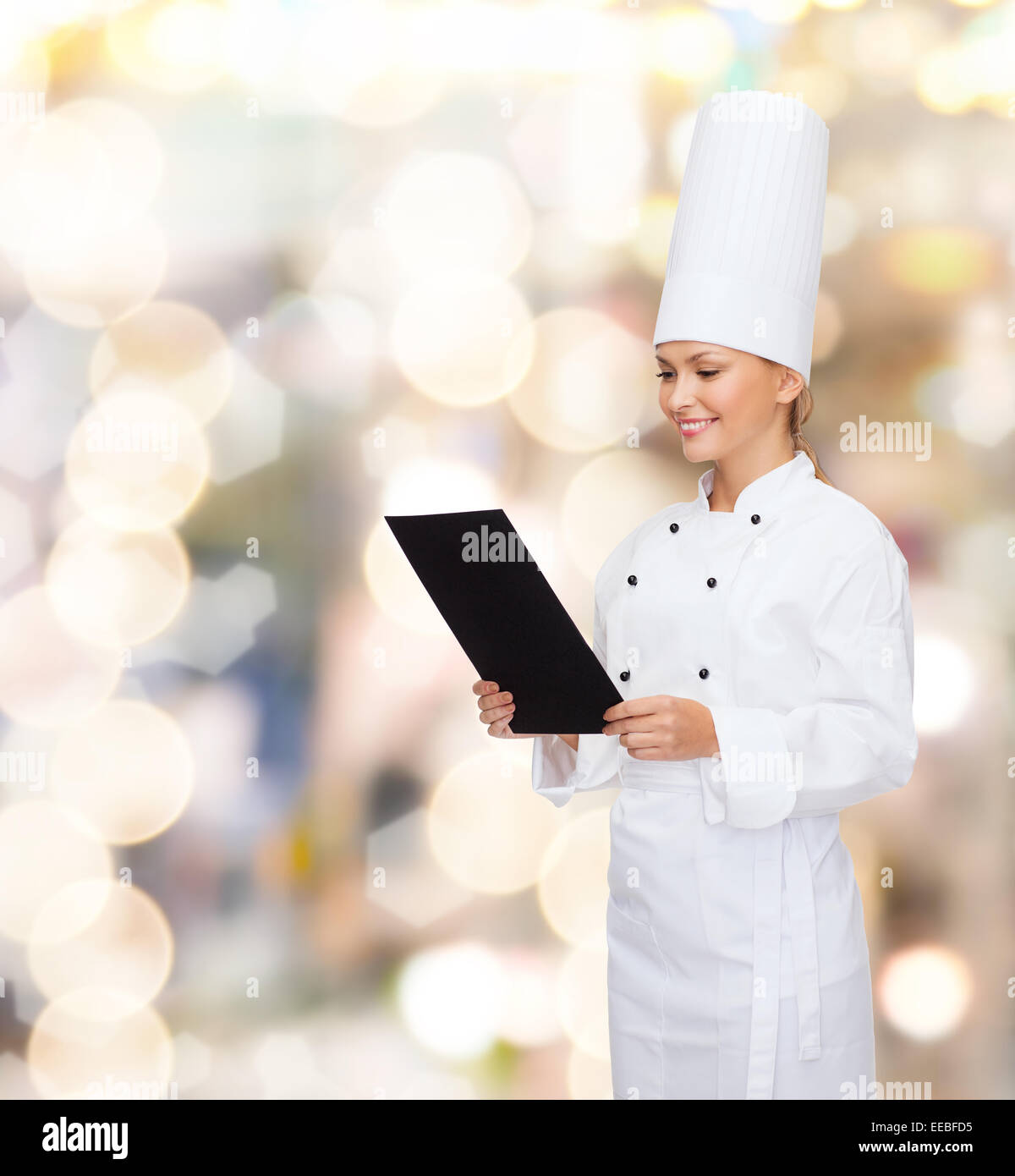 smiling female chef with black blank paper Stock Photo - Alamy