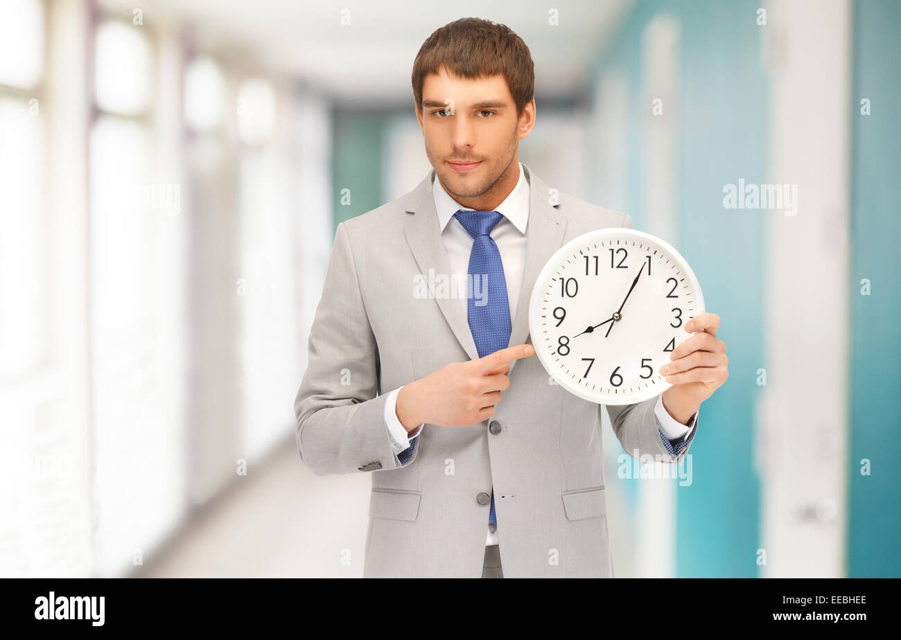 Businessman showing alarm clock hi-res stock photography and images - Alamy