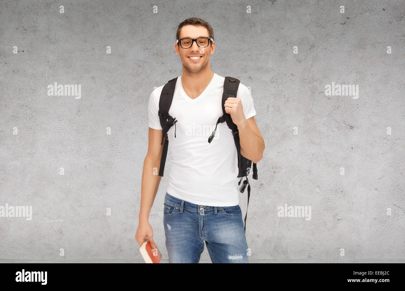 smiling student with backpack and book Stock Photo - Alamy
