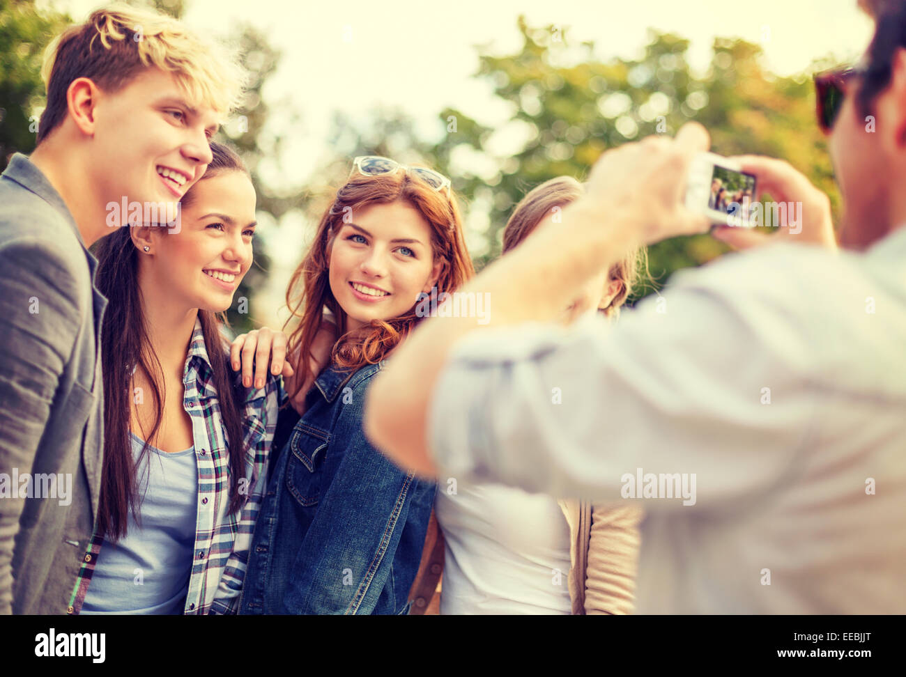 teenagers taking photo with digital camera outside Stock Photo - Alamy