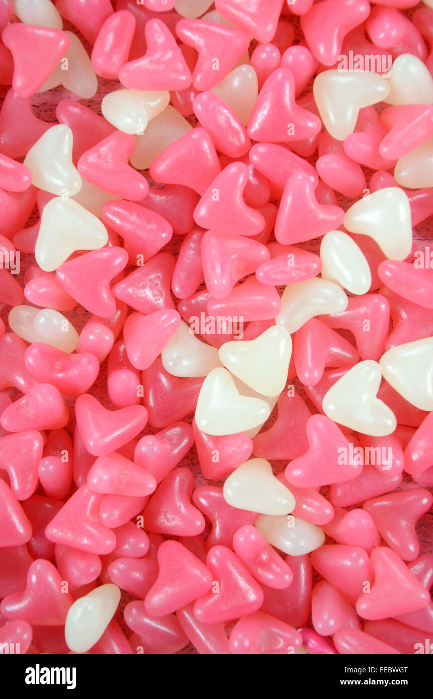 Pink and white heart shape jelly candy confectionery background ...