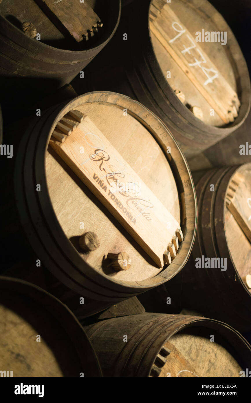 Wooden wine barrels in the cellar at the Bodega R. Lopez de Heredia ...