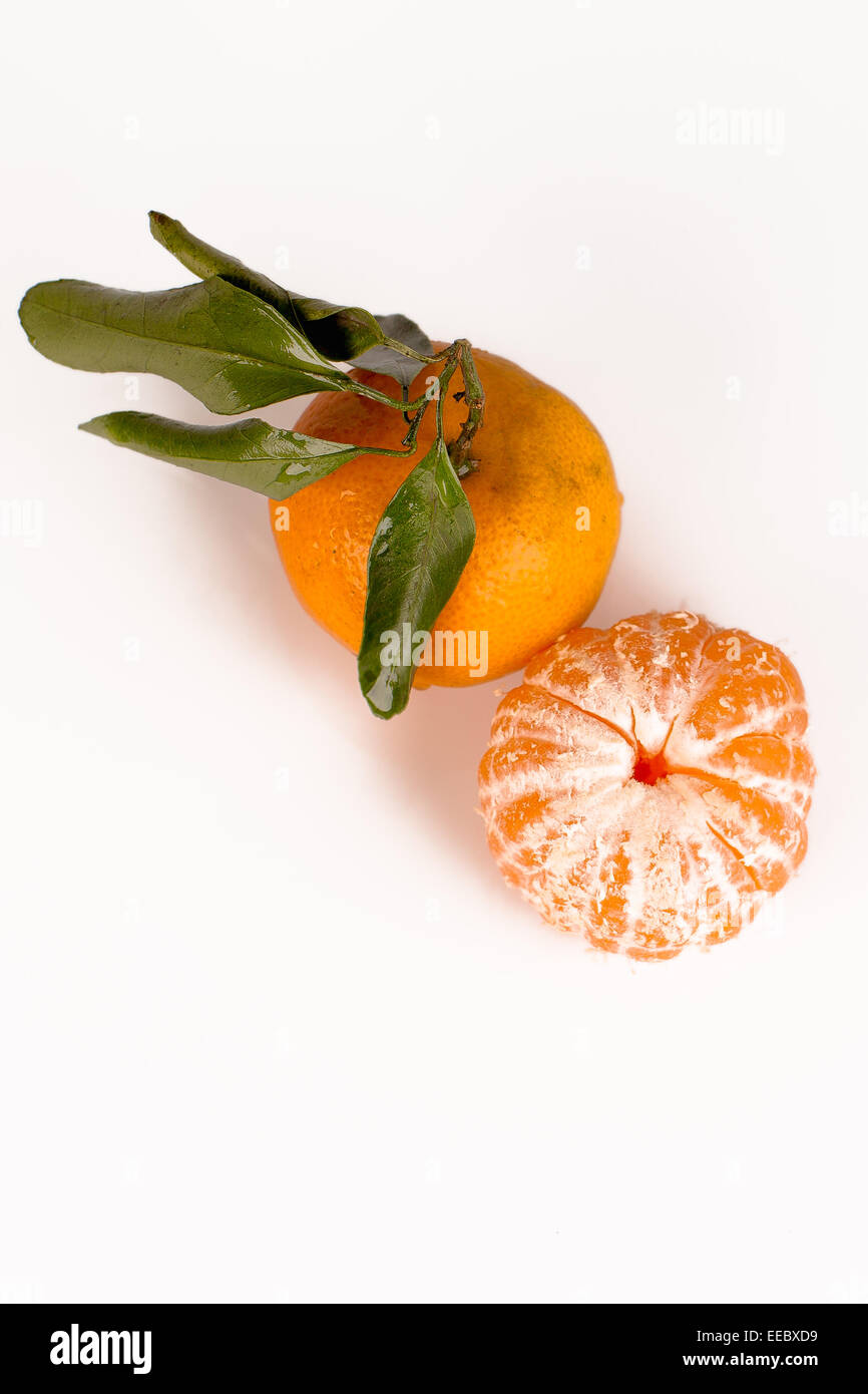 fresh mandarin with leaf isolated on white Stock Photo - Alamy