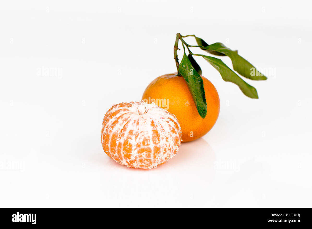 fresh mandarin with leaf isolated on white Stock Photo - Alamy