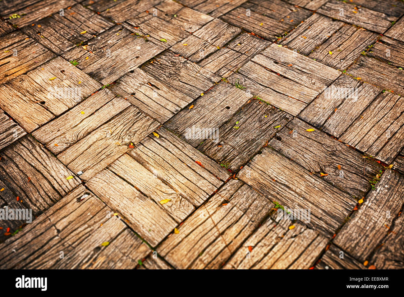 Background, depicting a weathered, parquet style wooden deck with ...