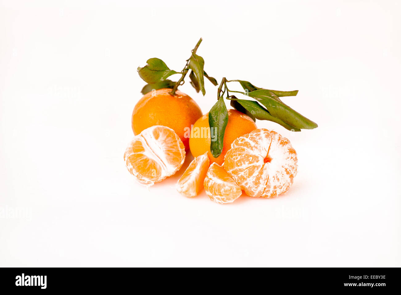 fresh mandarin with leaf isolated on white Stock Photo - Alamy