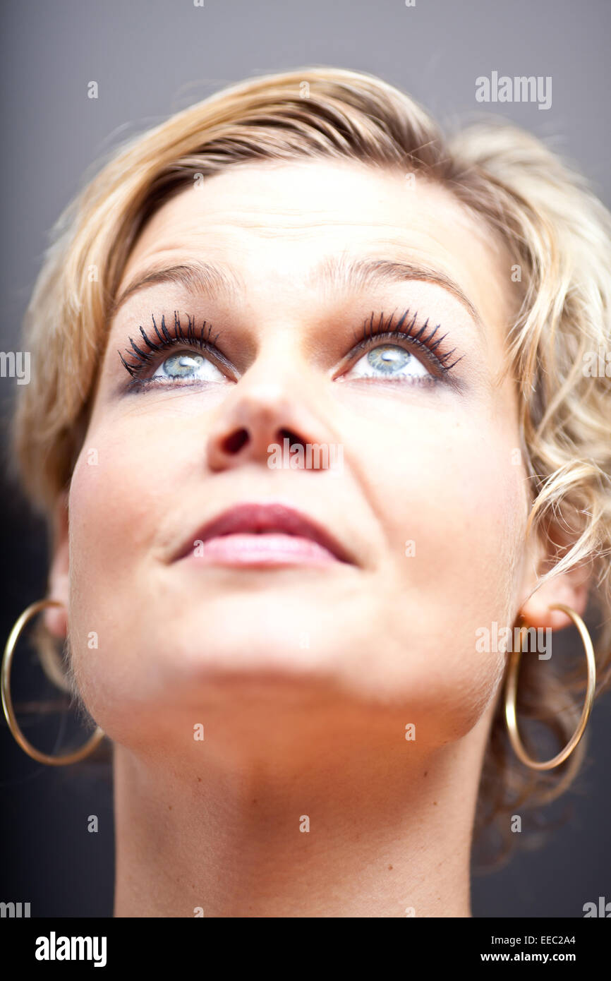 Cute girl face closeup looking up Stock Photo - Alamy