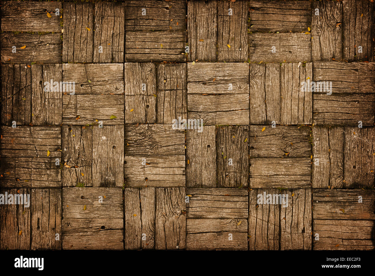 Background, depicting an old, weathered, parquet style wooden deck with ...