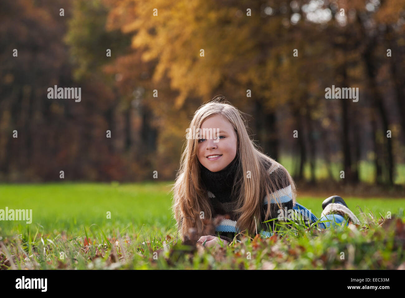 Teenage girl in autumn landscape Stock Photo - Alamy