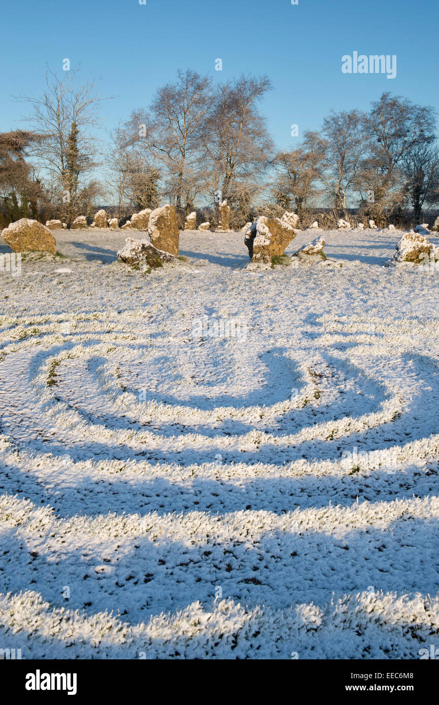 Labyrinth symbol at the Rollright stones covered in snow in winter ...