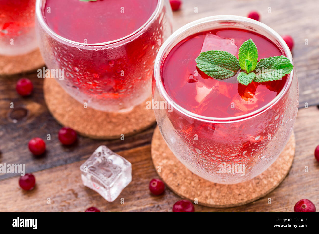 Cranberry cocktail with mint garnish Stock Photo - Alamy