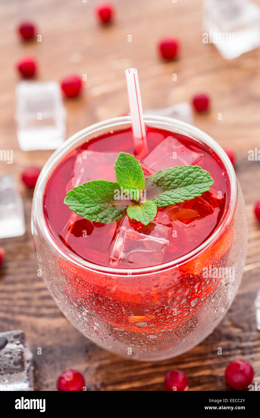 Cranberry cocktail with mint garnish Stock Photo - Alamy