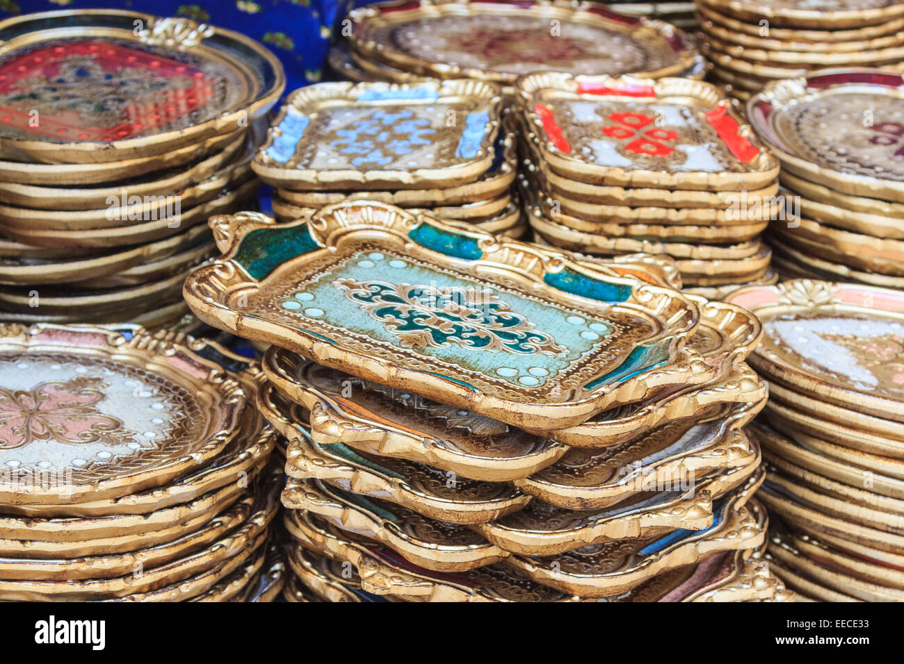 Stapled ornate golden trivets and tablets Stock Photo - Alamy