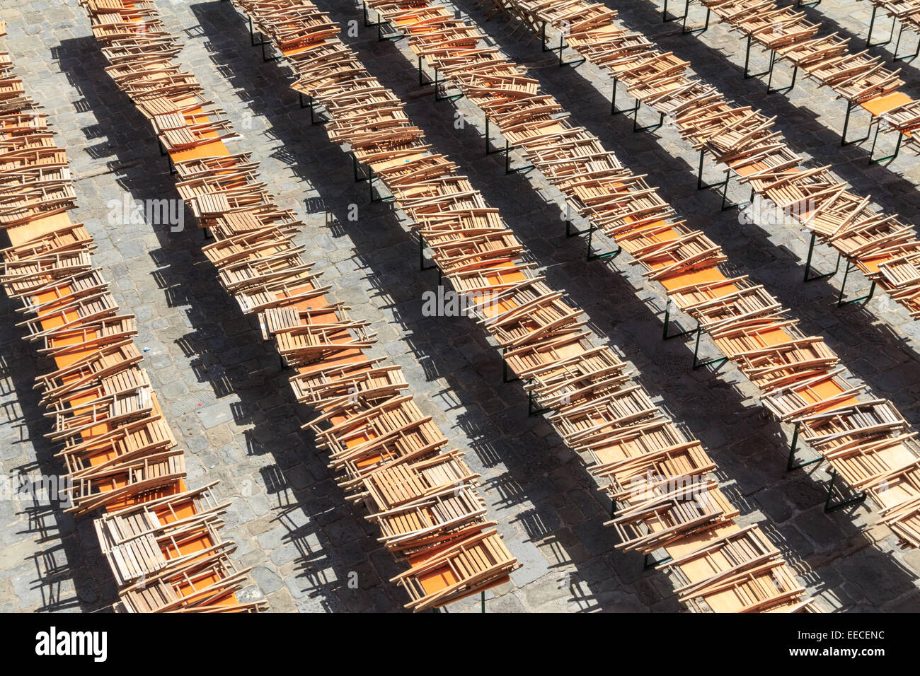 Many folded wooden chairs on tables seen from above Stock Photo - Alamy