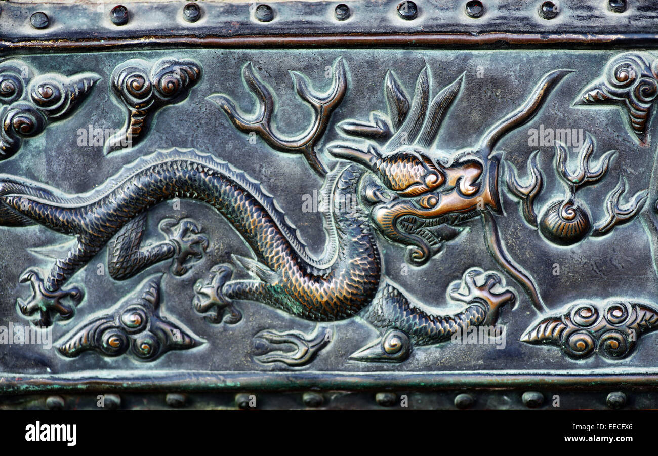Color detail of a dragon bronze engraving in China Stock Photo - Alamy