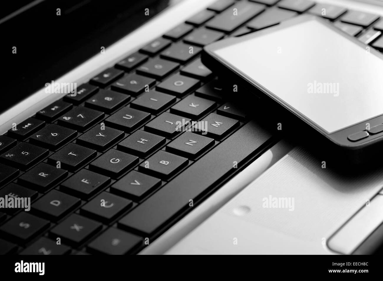 Smart phone and laptop - business concept Stock Photo - Alamy