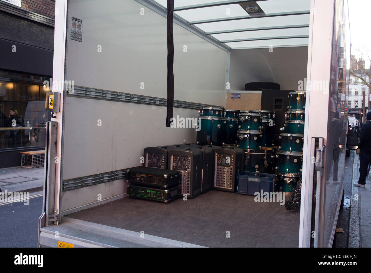 Drums and musical instruments and equipment in back of a removal van ...