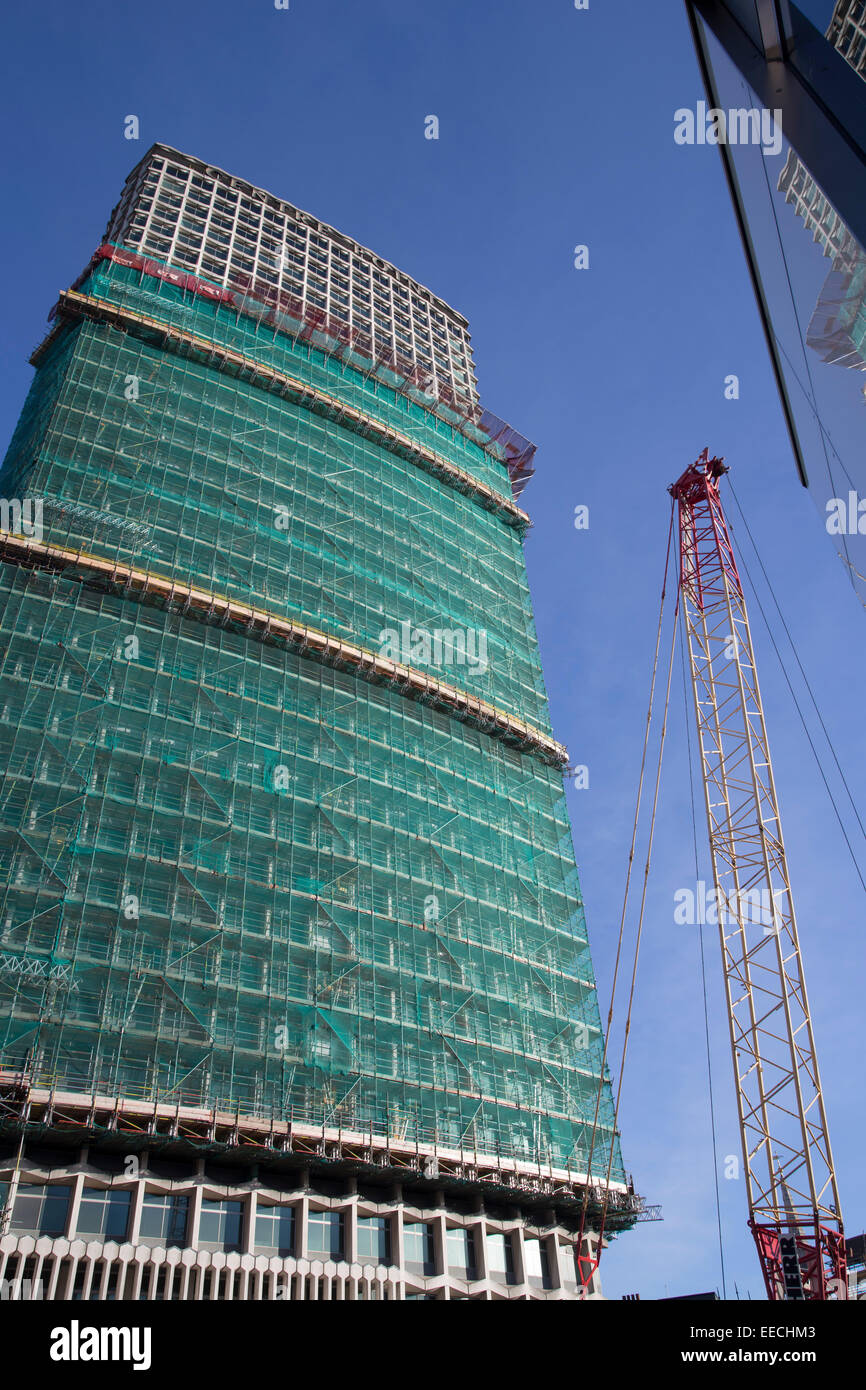 Centre Point building covered in scaffolding. With crane. By Tottenham ...