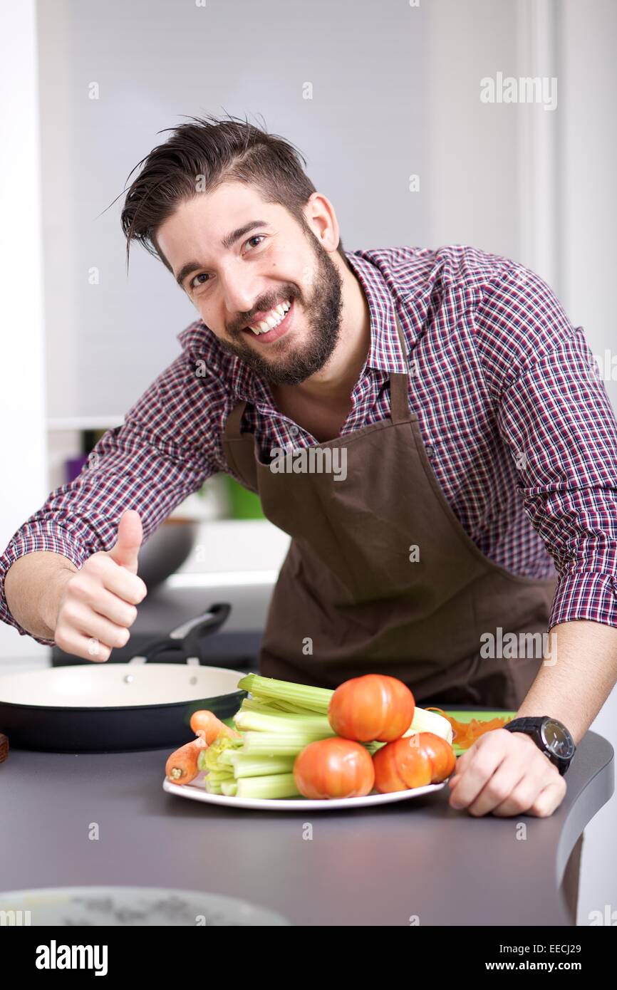 young man cooking Stock Photo - Alamy