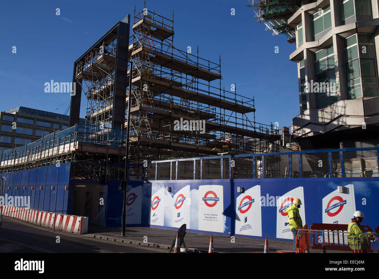 Crossrail rail extension project. Workmen, hoardings and scaffolding ...