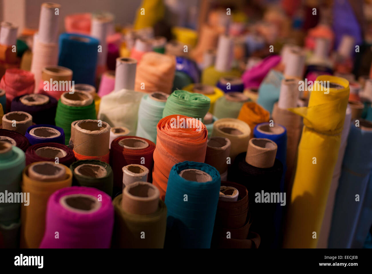 Rolls of various fabrics in a shop Stock Photo - Alamy