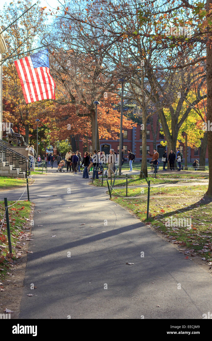 Tourists and students at the John Harvard statue on a beautiful fall ...