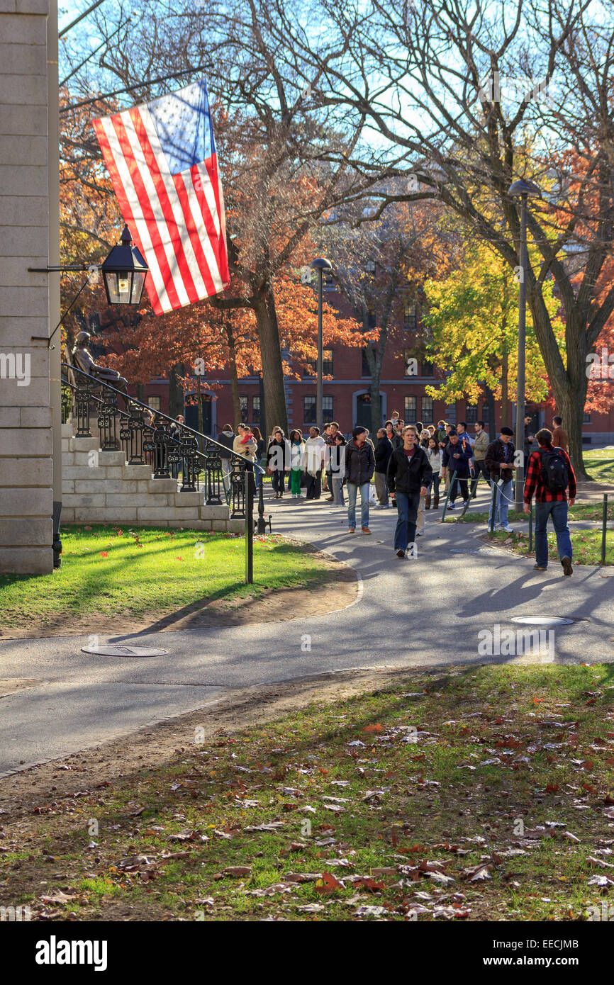 Tourists and students at the John Harvard statue on a beautiful fall ...