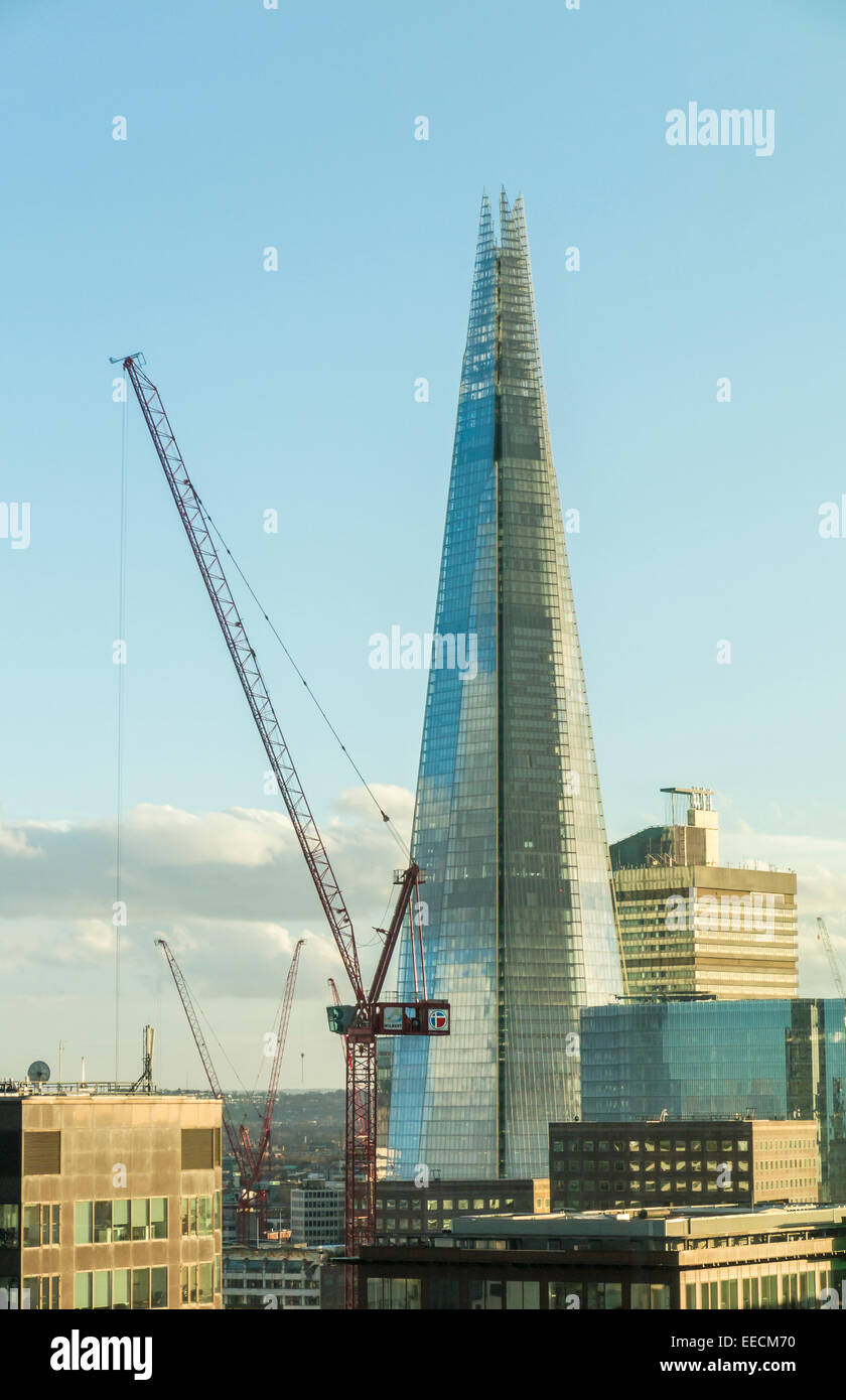 The Shard skyscraper with a tower crane in front, 32 London Bridge ...